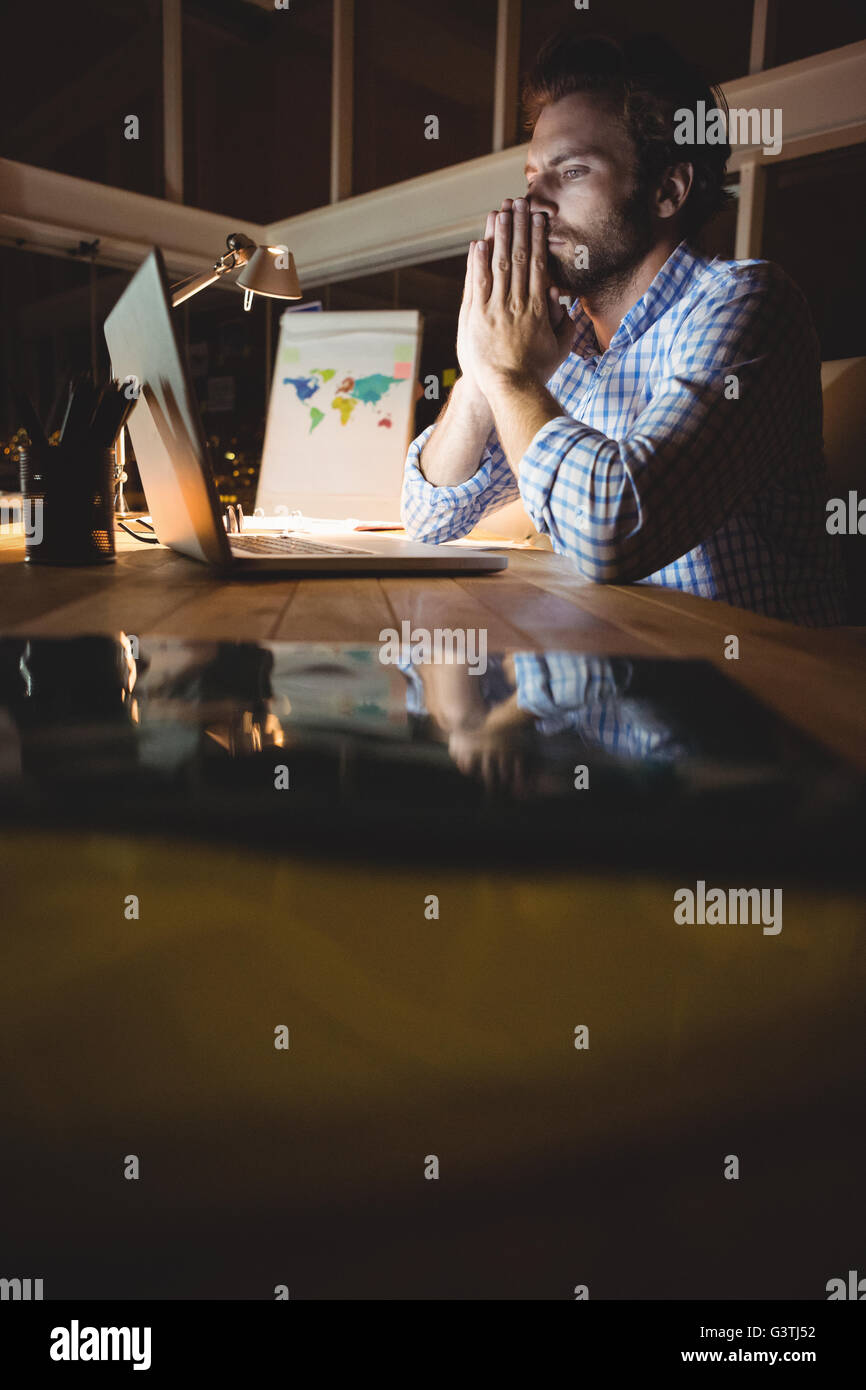 Overworked businessman working at night Stock Photo - Alamy