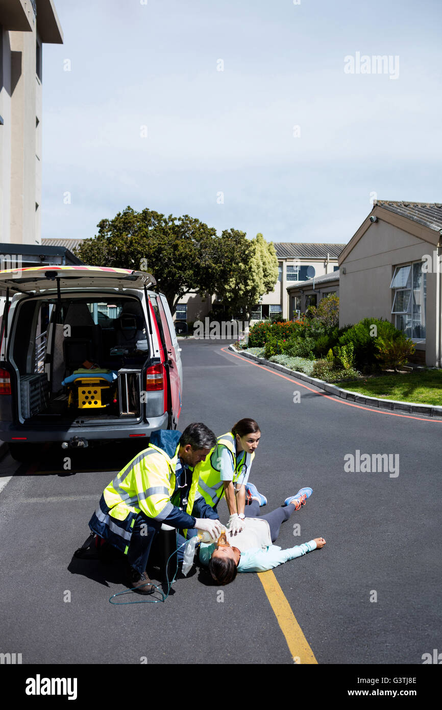 Ambulance men taking care of injured people Stock Photo - Alamy