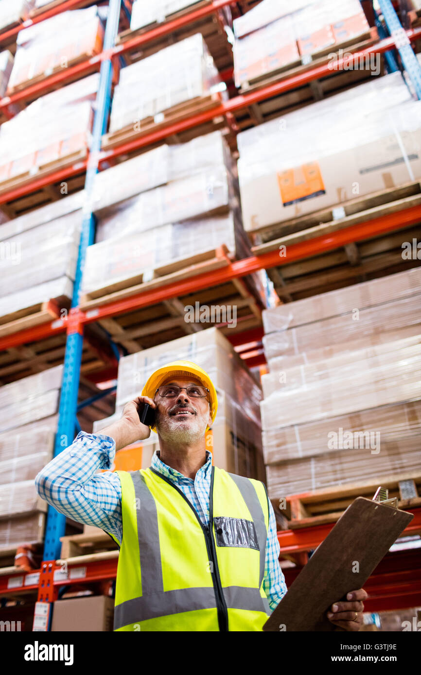 Warehouse worker phone hi-res stock photography and images - Alamy