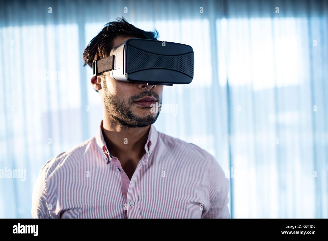 Businessman using an oculus Stock Photo - Alamy