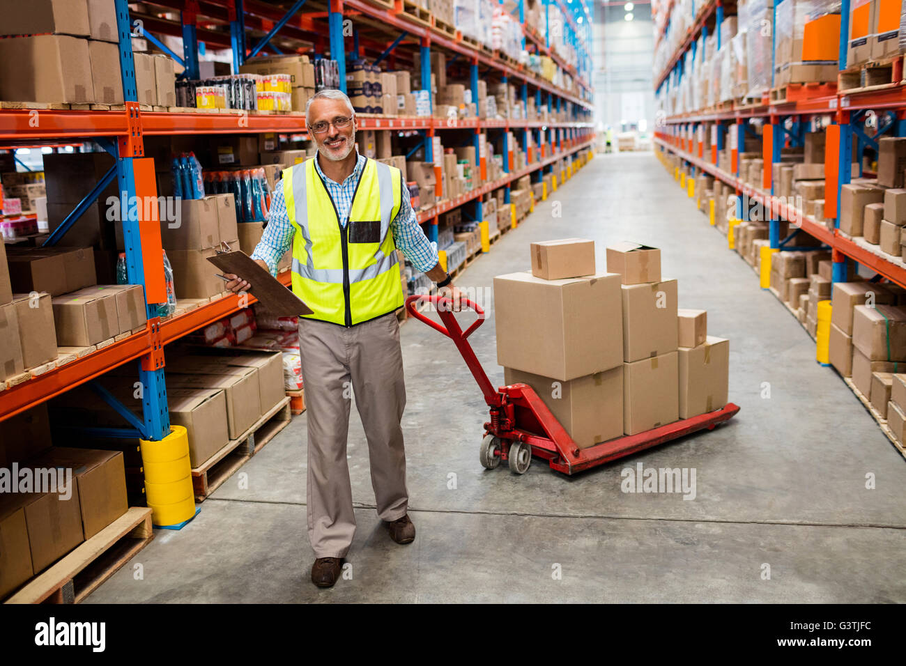 Man pulling trolley hi-res stock photography and images - Alamy