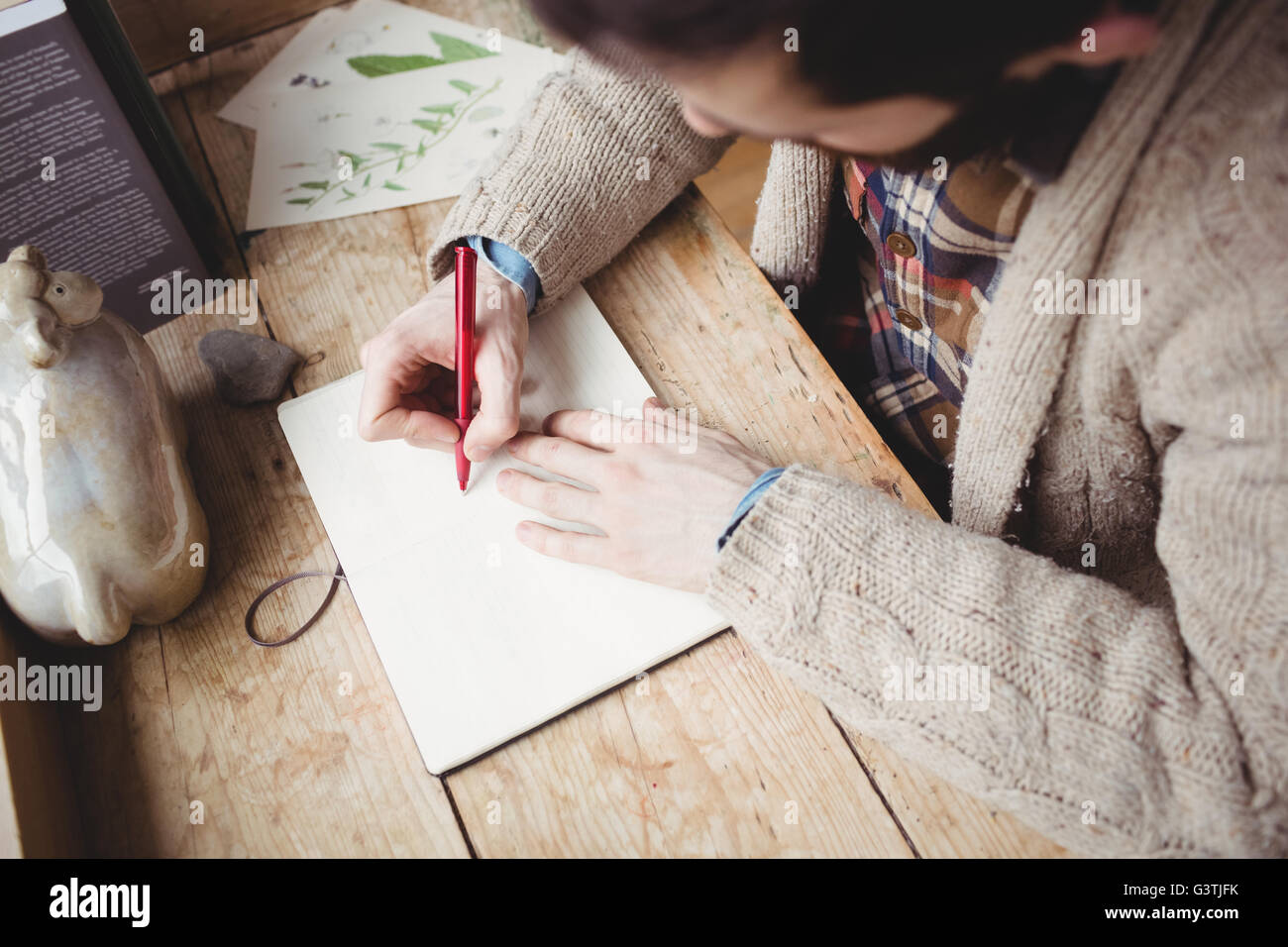 Man beard sitting writing hi-res stock photography and images - Alamy