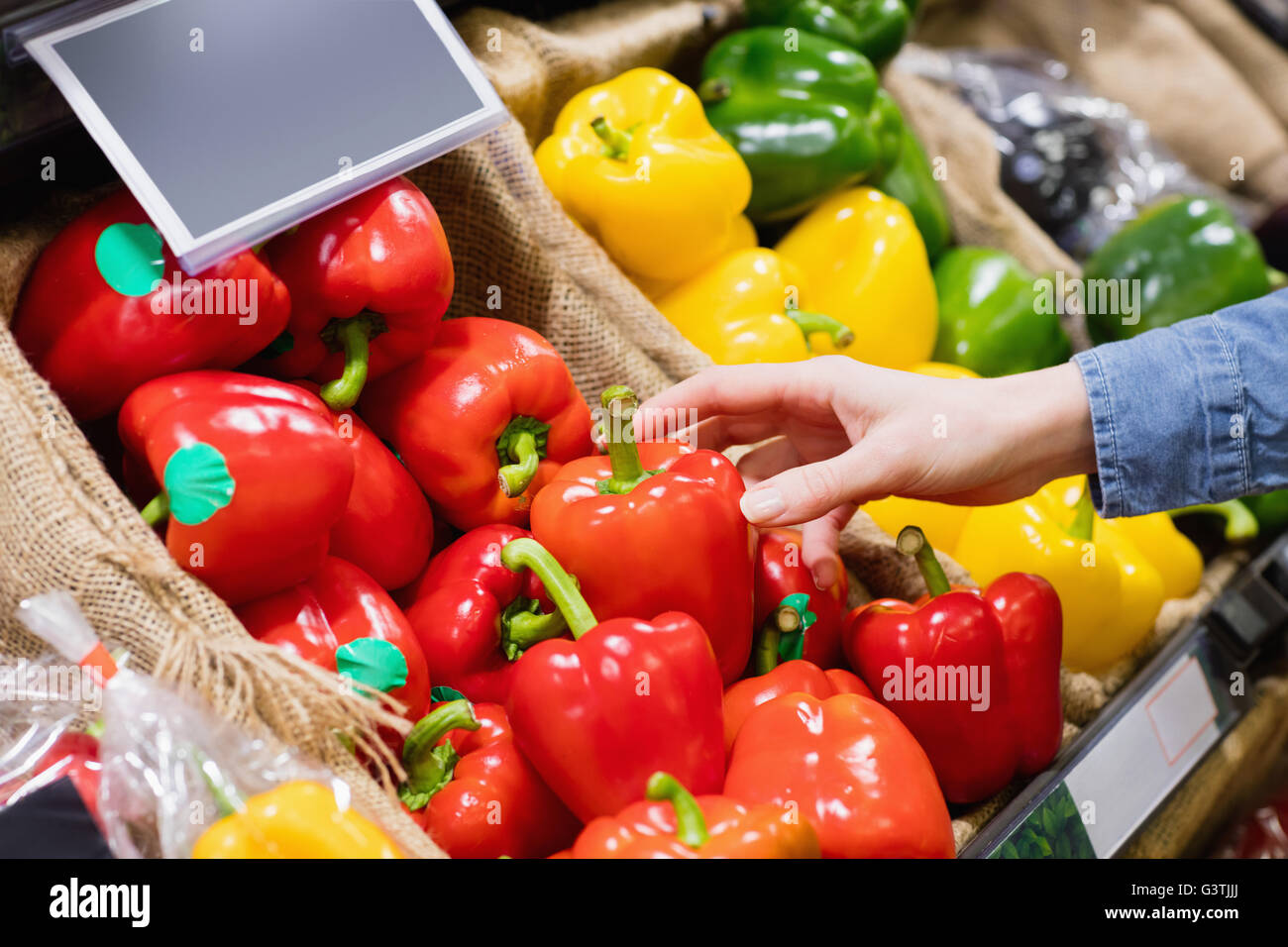Hand picking a pepper Stock Photo - Alamy