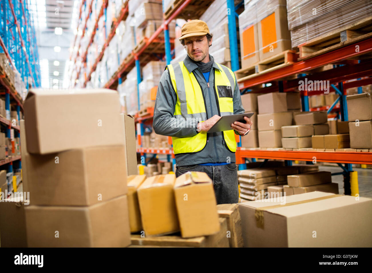 Worker using digital tablet Stock Photo - Alamy