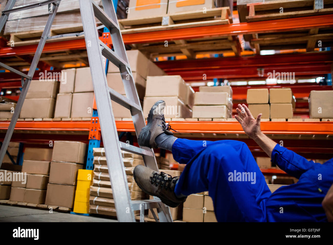 Worker falling down ladder Stock Photo - Alamy
