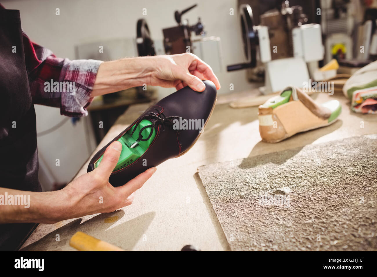 Close up of hands holding a shoe Stock Photo - Alamy