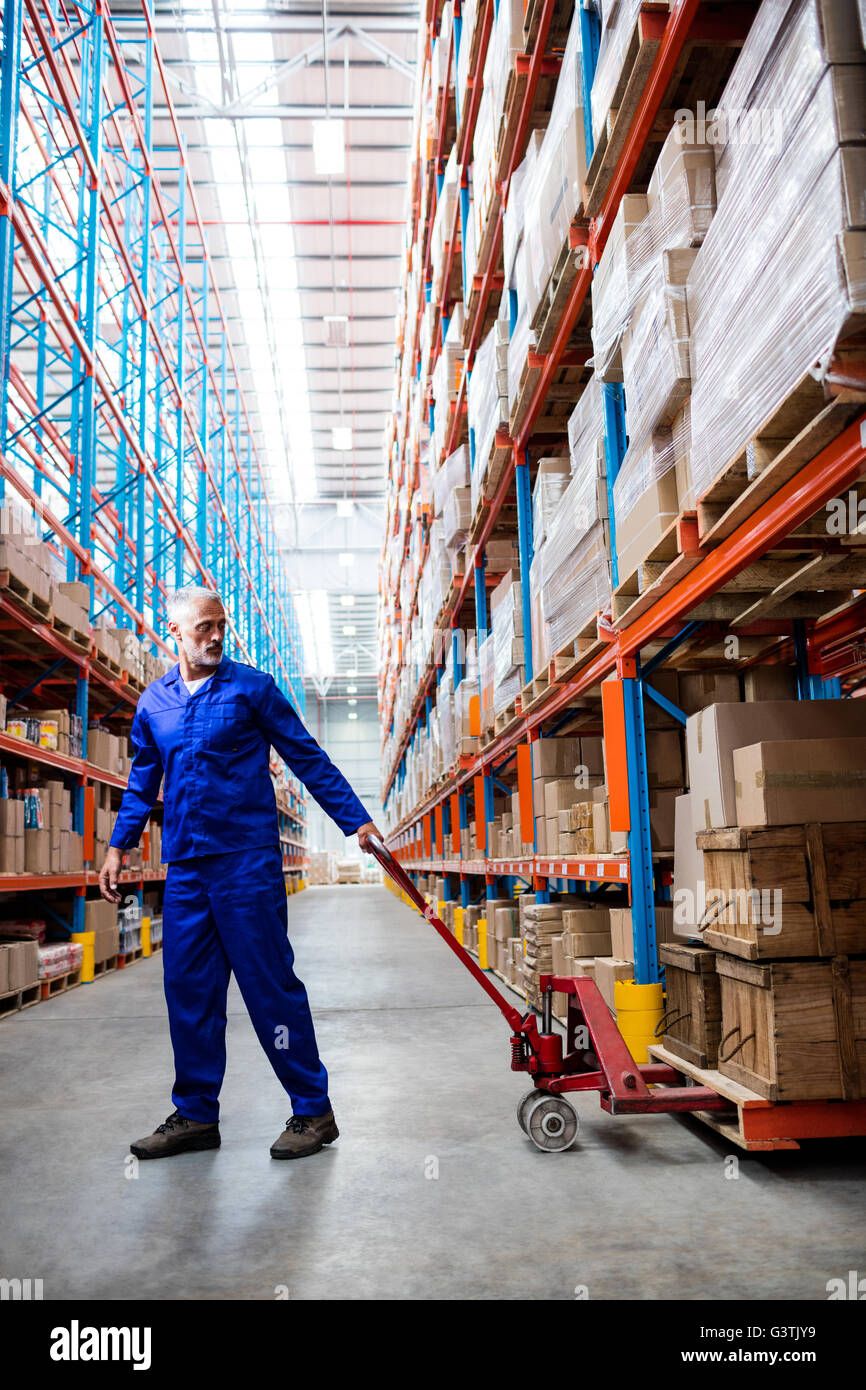 Warehouse pulling pallet truck boxes hi-res stock photography and ...
