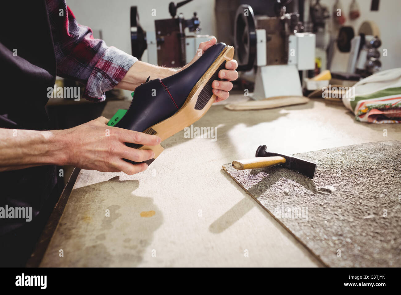 Close up of hands holding a shoe Stock Photo - Alamy