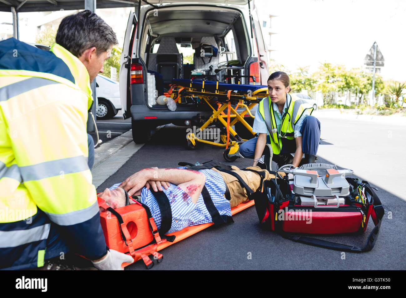 Injured woman on stretcher hi-res stock photography and images - Alamy