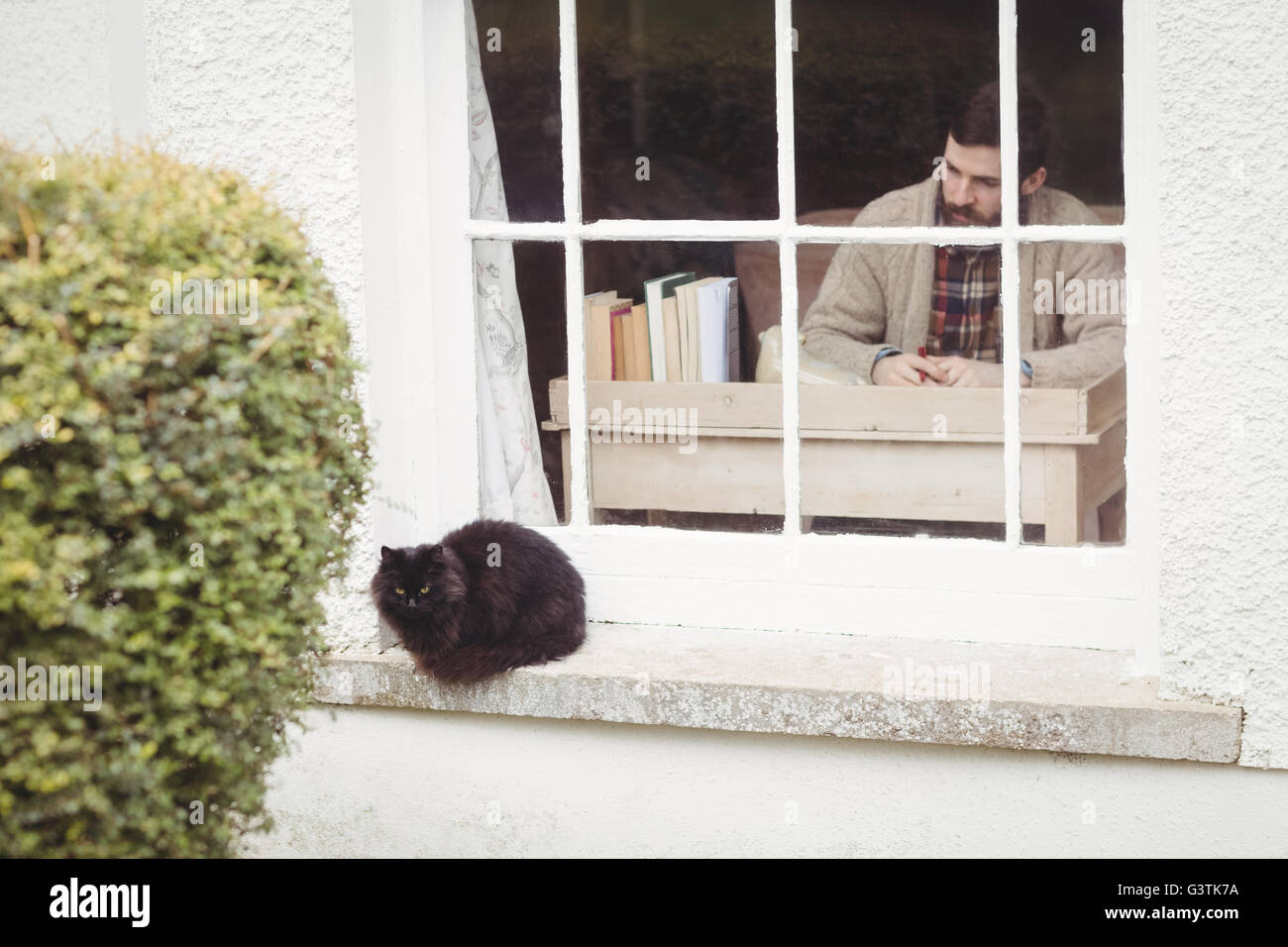 Man facing window hi-res stock photography and images - Alamy