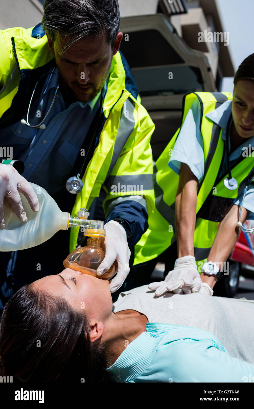 Ambulance men taking care of injured people Stock Photo - Alamy
