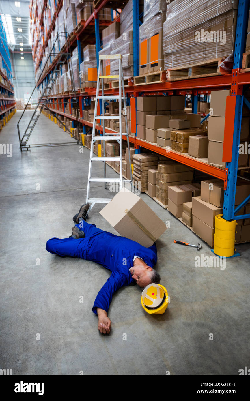Unconscious worker lying on the floor Stock Photo - Alamy