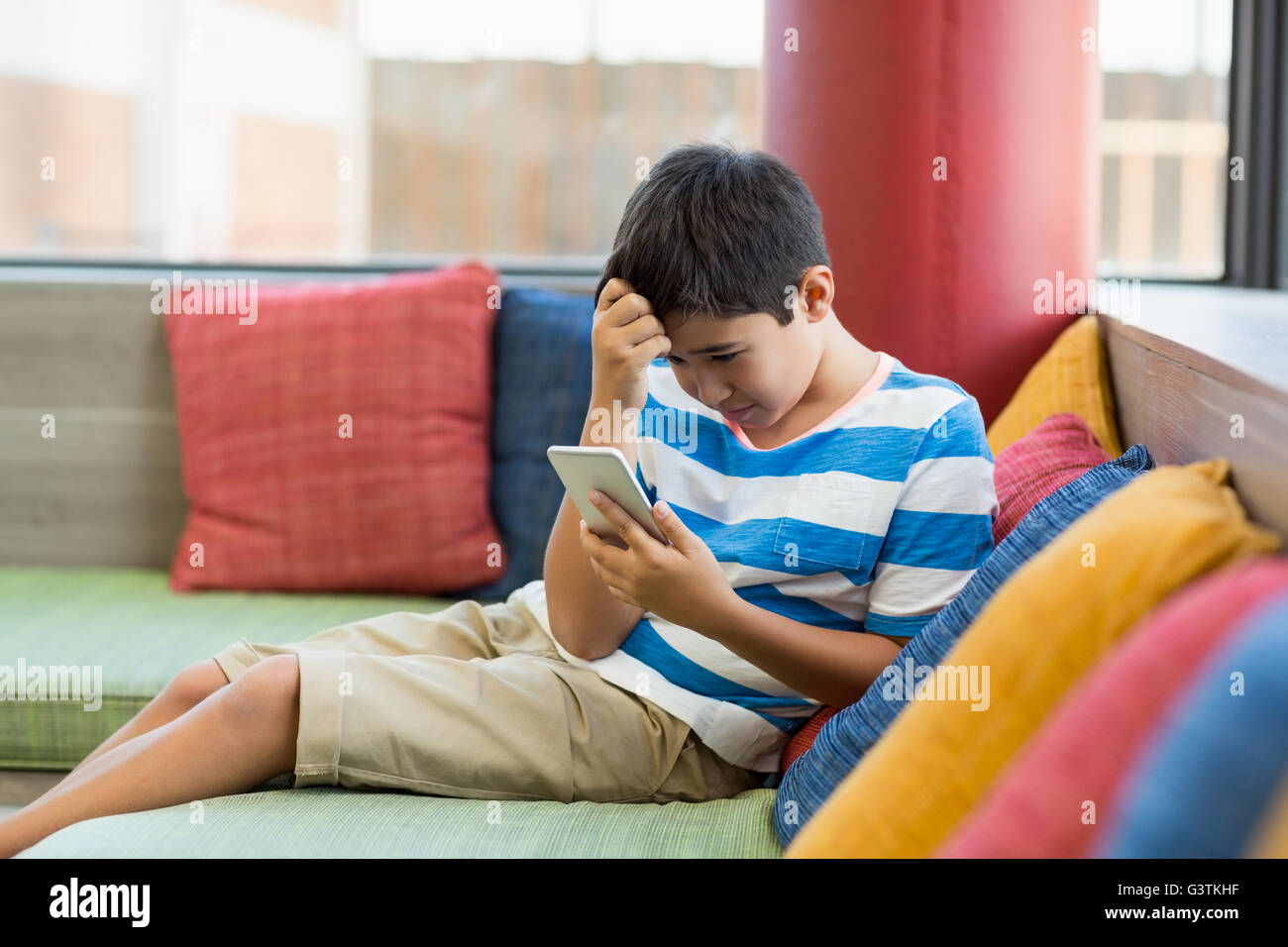 Boy using mobile phone upset hi-res stock photography and images - Alamy