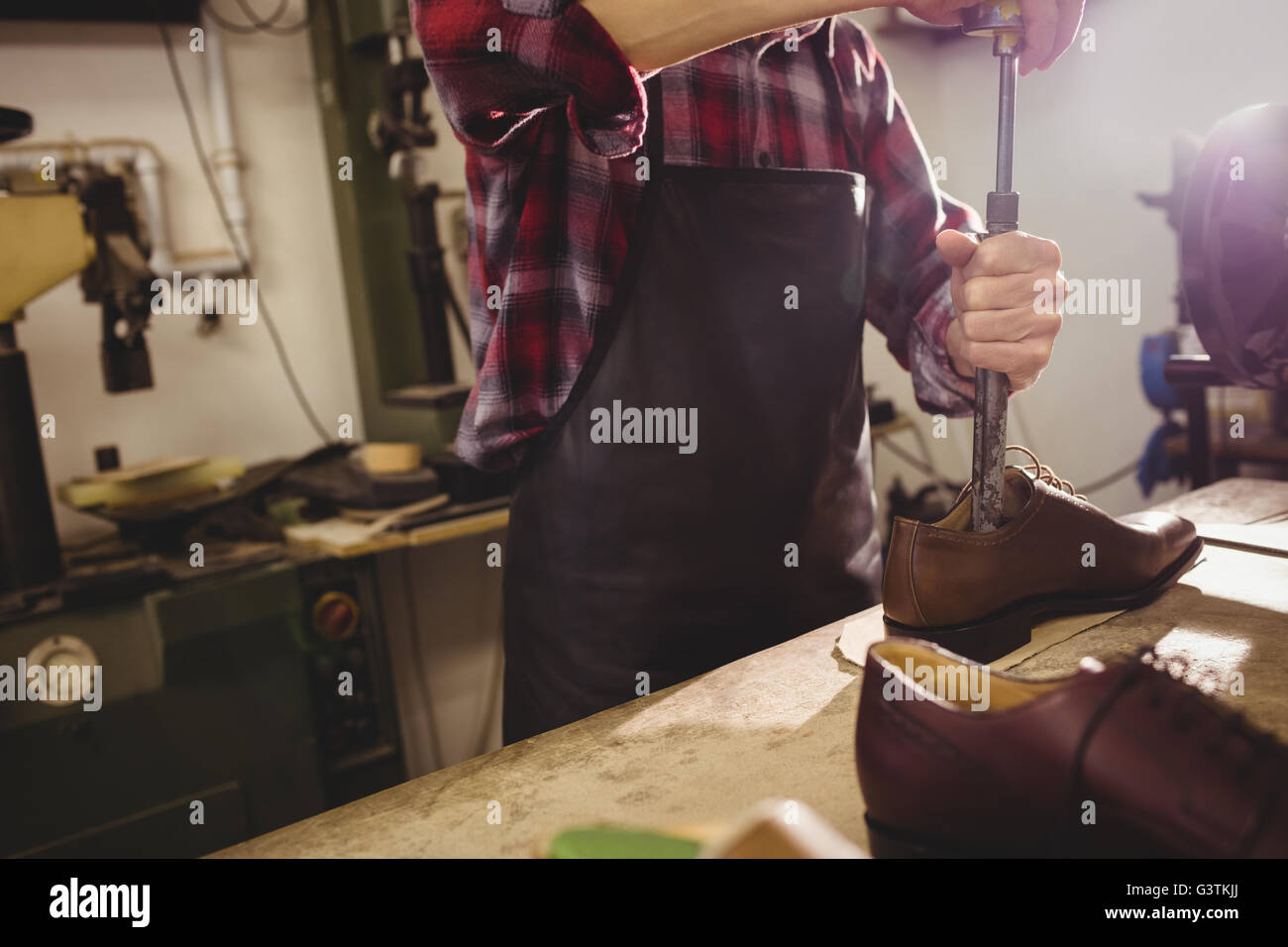 Close up of cobbler making shoes Stock Photo - Alamy