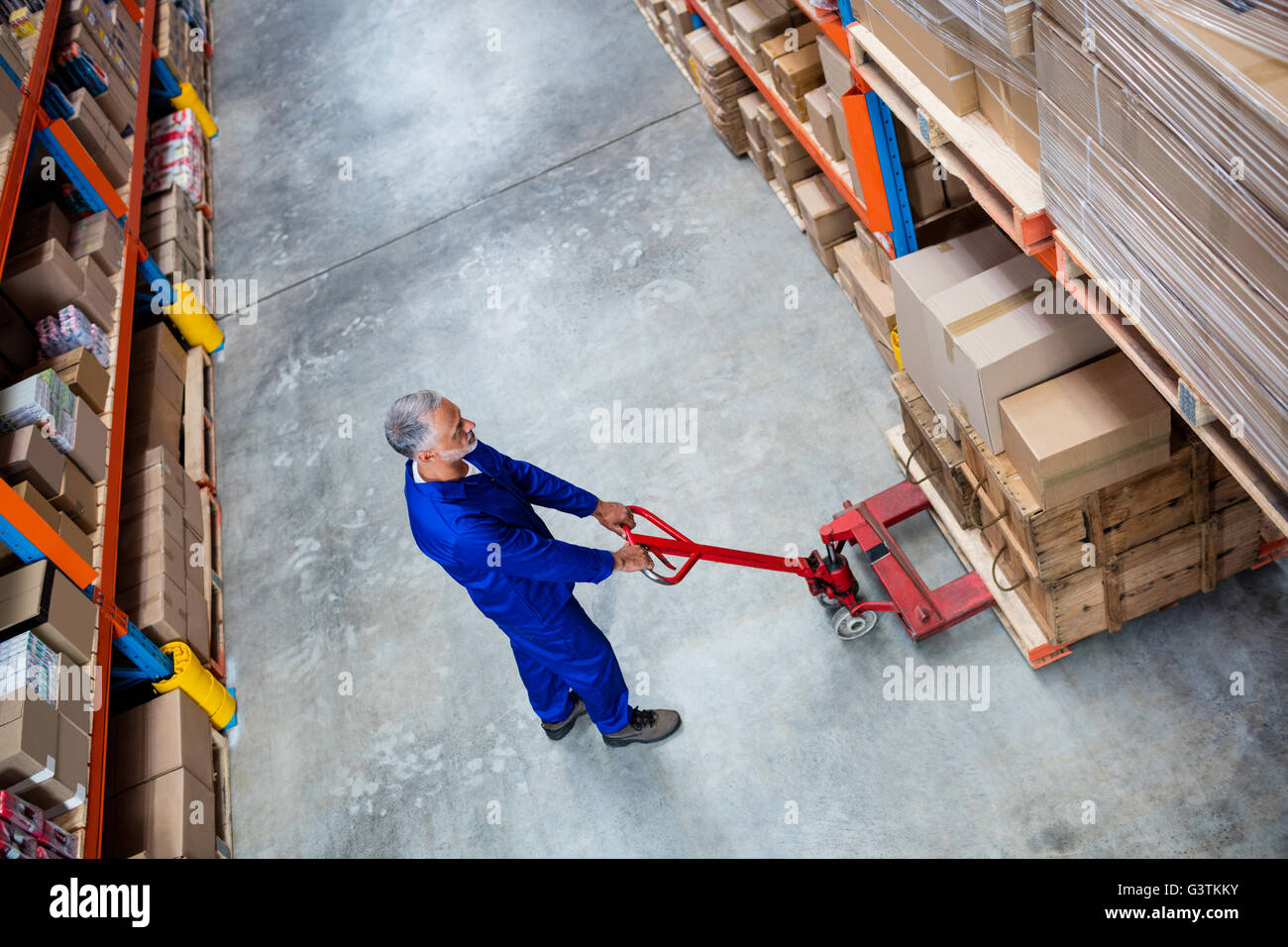 Warehouse pulling pallet truck boxes hi-res stock photography and ...