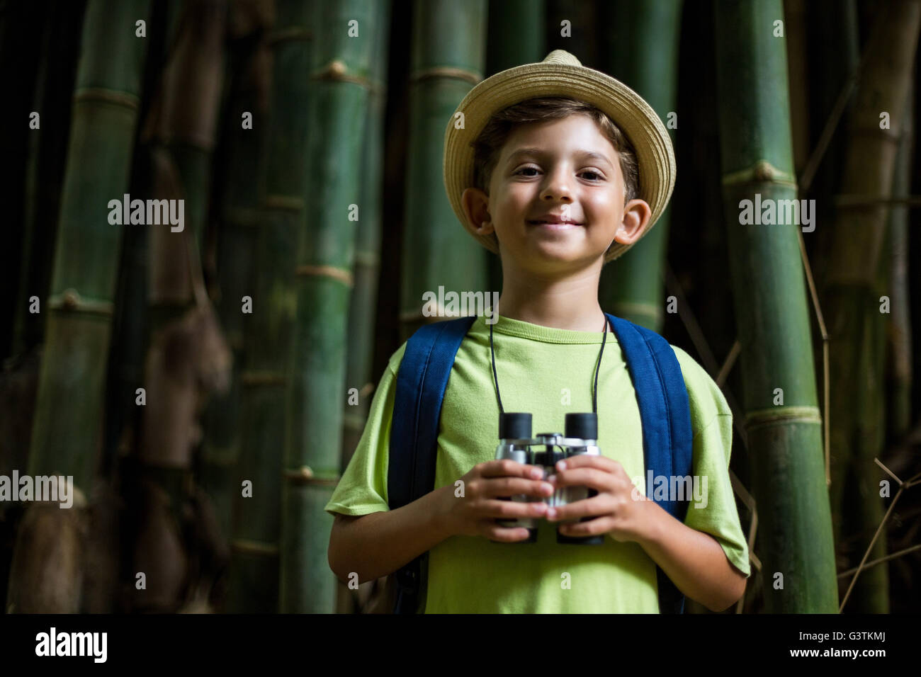 Boy standing in forest Stock Photo - Alamy