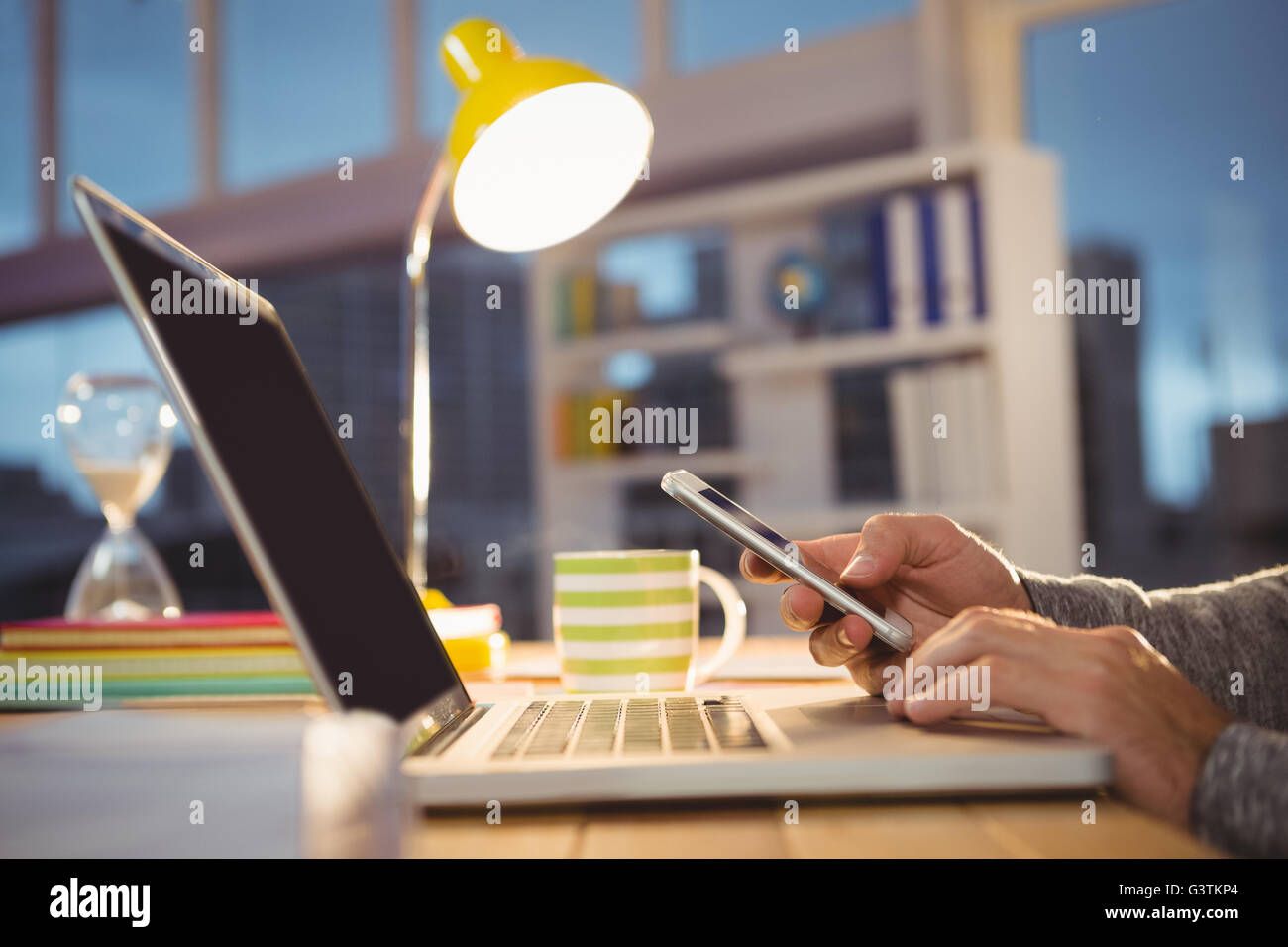 Using smartphone laptop hi-res stock photography and images - Alamy