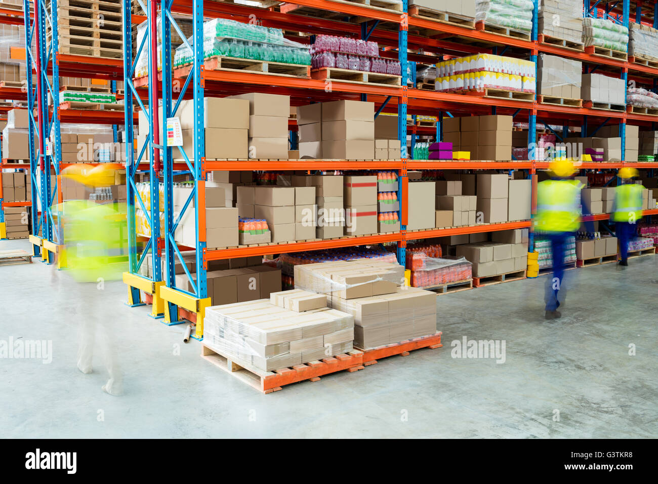 Warehouse workers working together Stock Photo - Alamy