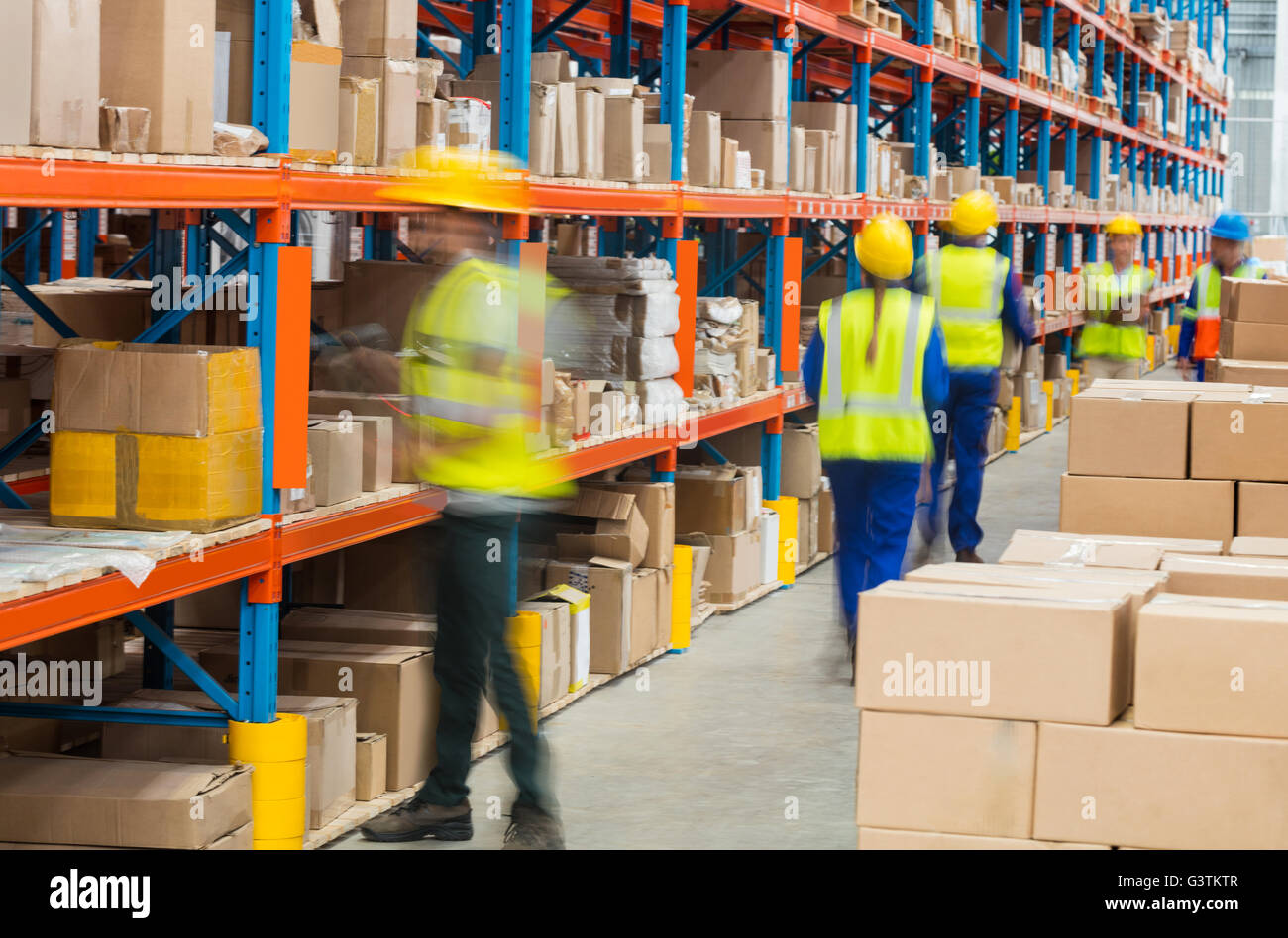Warehouse workers working together Stock Photo - Alamy
