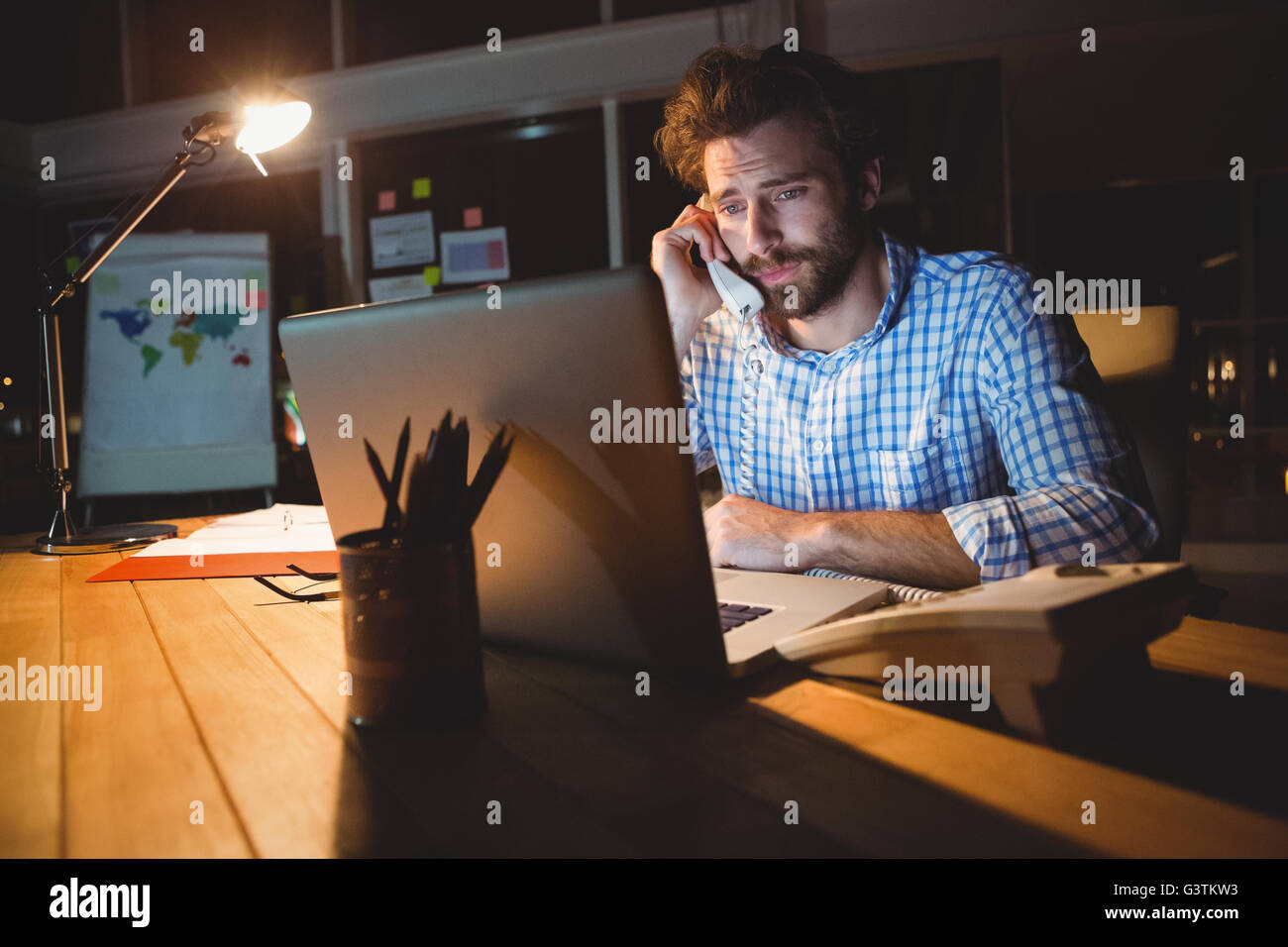 Businessman making a phone call at night Stock Photo - Alamy
