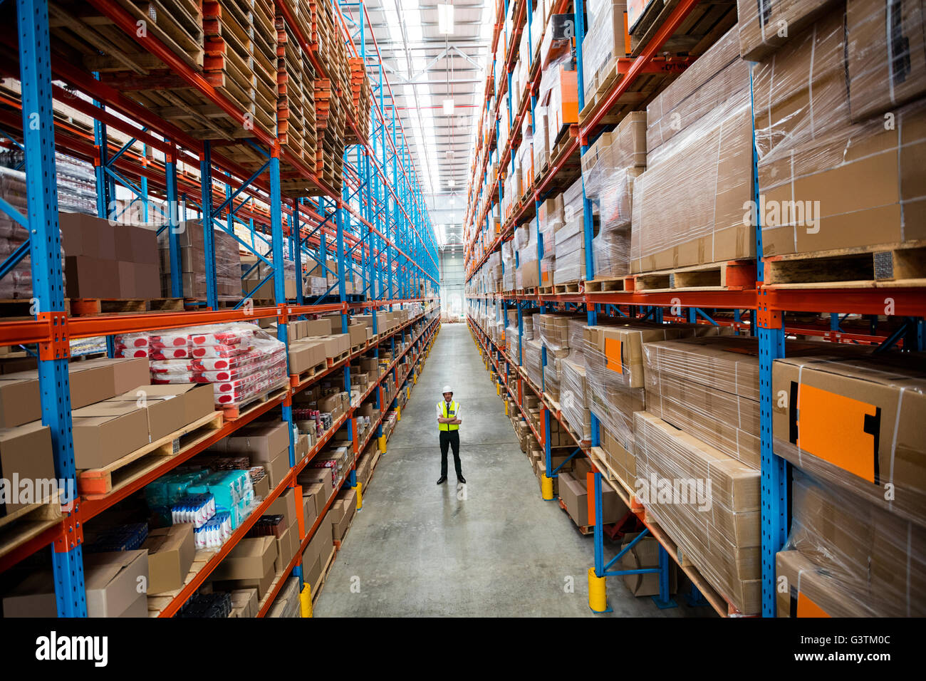 Portrait of a warehouse manager in an aisle Stock Photo - Alamy