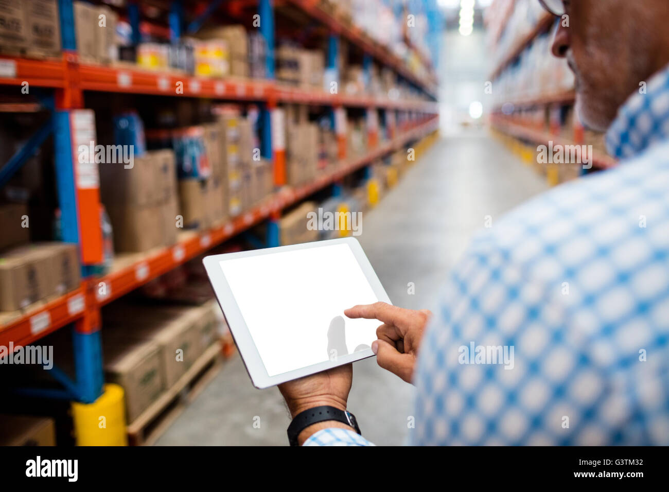 Male manager using tablet inventory hi-res stock photography and images ...