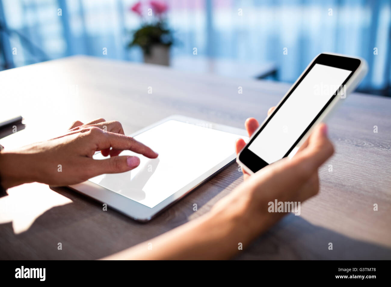 Woman scrolling smartphone desk hi-res stock photography and images - Alamy