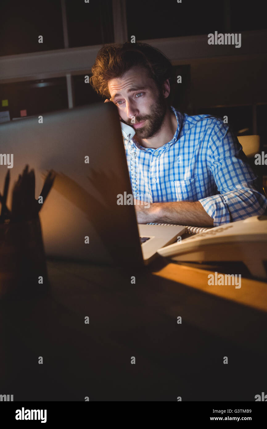 Businessman making a phone call at night Stock Photo - Alamy