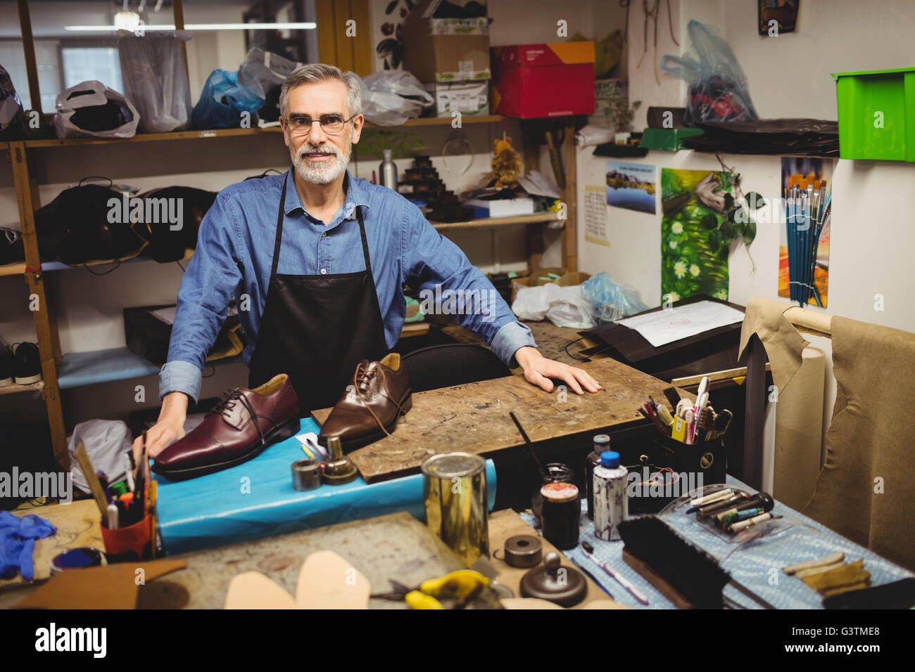 Cobbler smiling and posing Stock Photo - Alamy