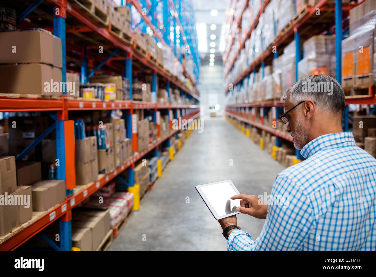 Manager using his tablet Stock Photo - Alamy