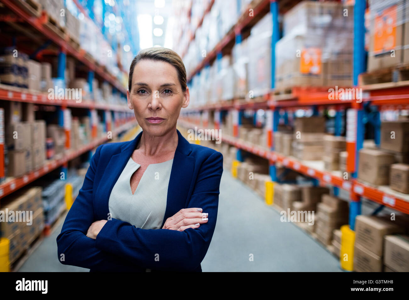 Portrait of warehouse manager standing Stock Photo - Alamy