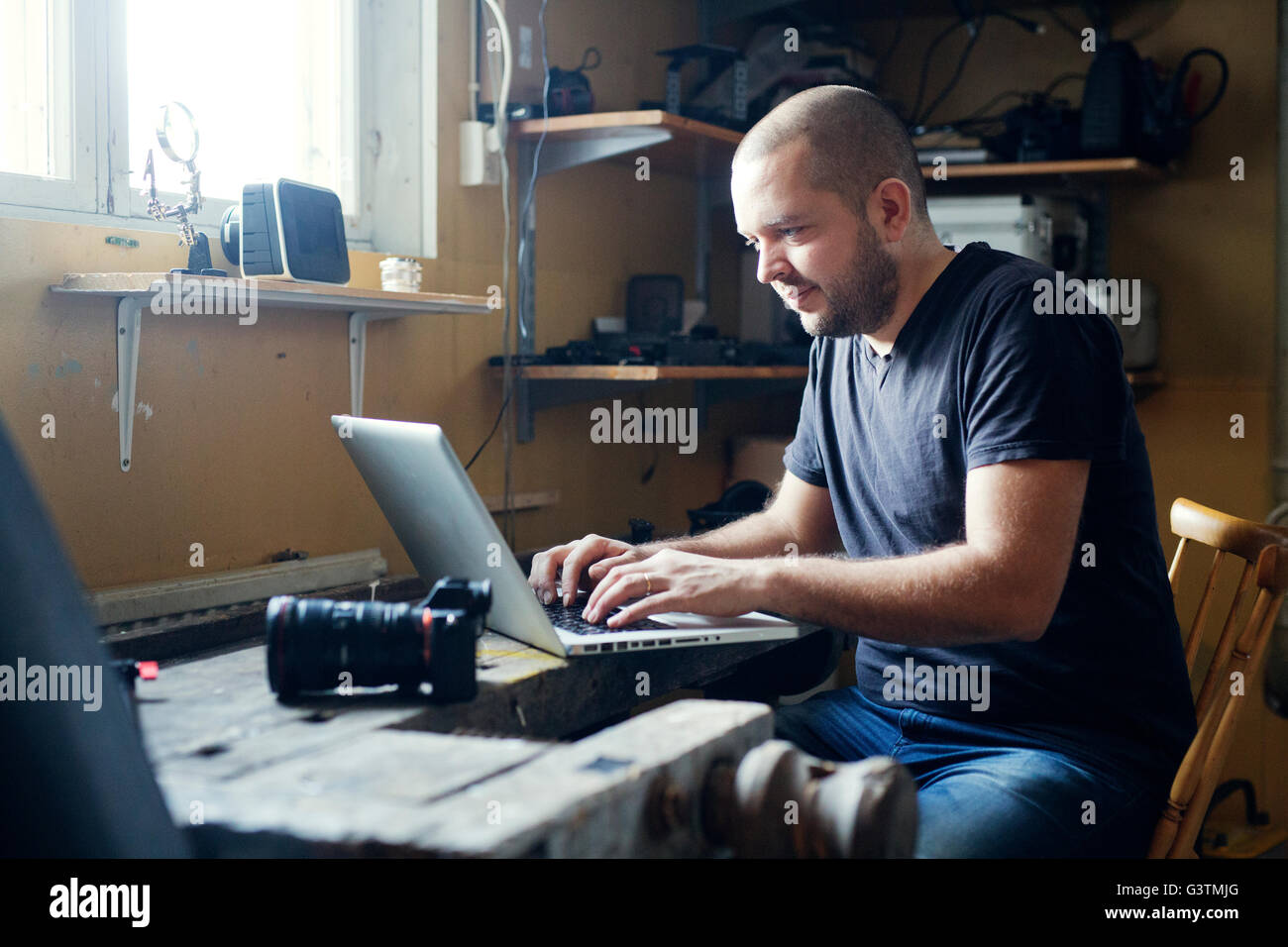 Man sitting desk using laptop hi-res stock photography and images - Alamy