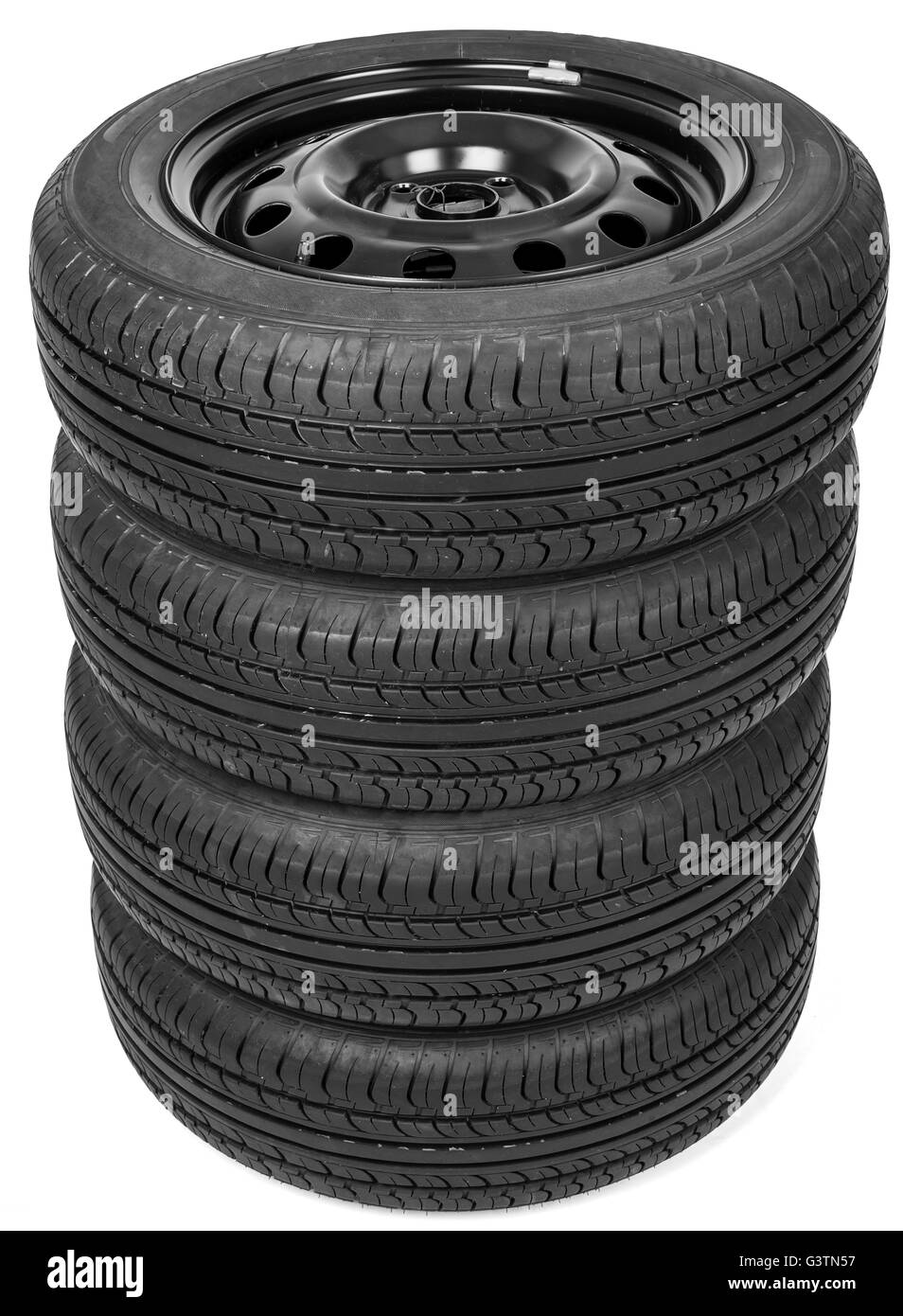 Stack of four wheel black tyres for summer Stock Photo - Alamy