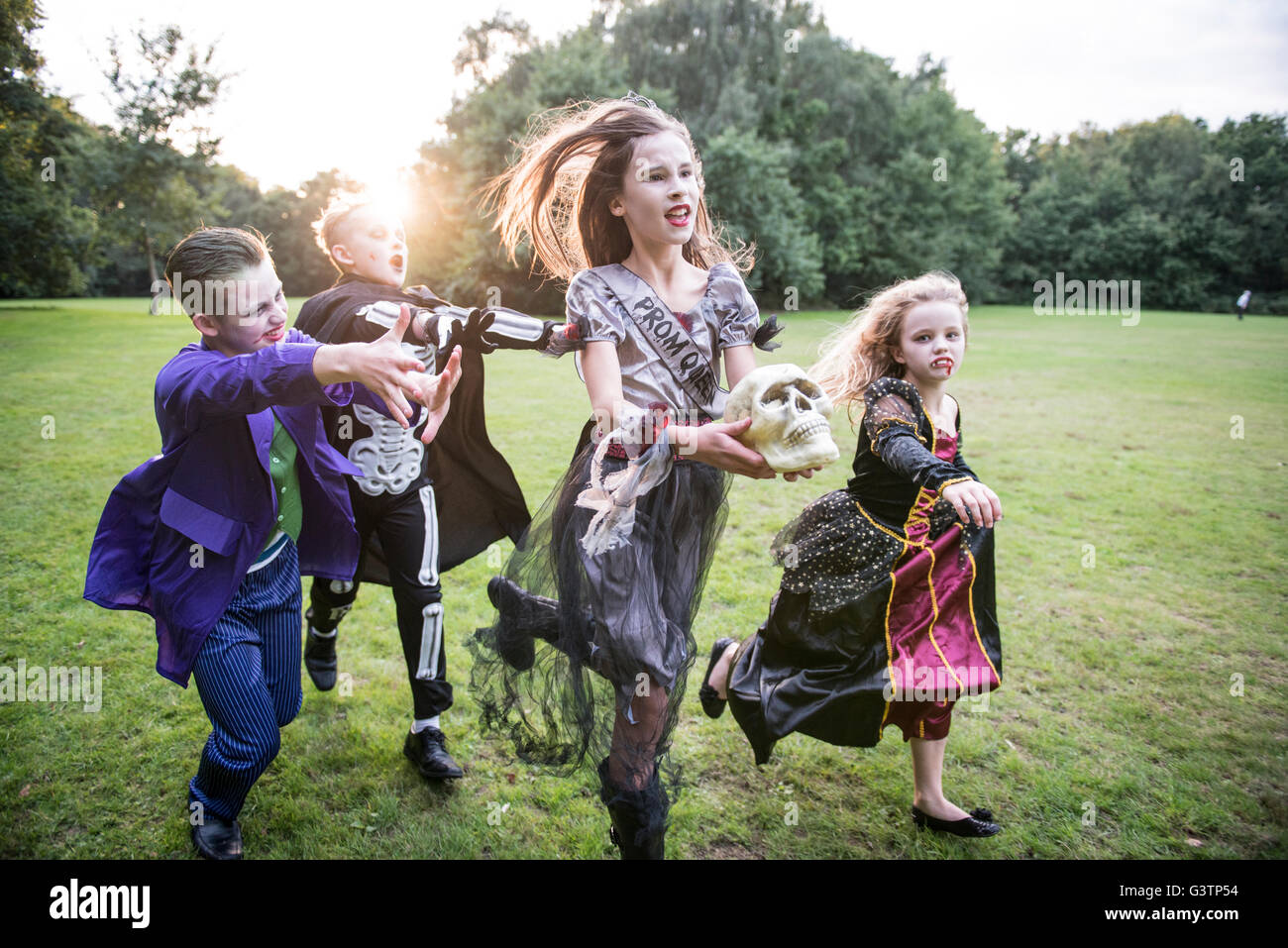 Children chase a girl dressed as a zombie prom queen for Halloween ...