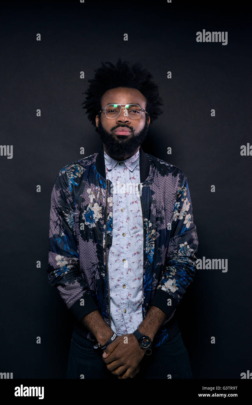 Studio portrait of a hip looking afro caribbean man Stock Photo - Alamy
