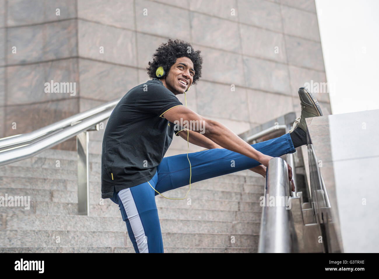 Young man limbering up jog hi-res stock photography and images - Alamy