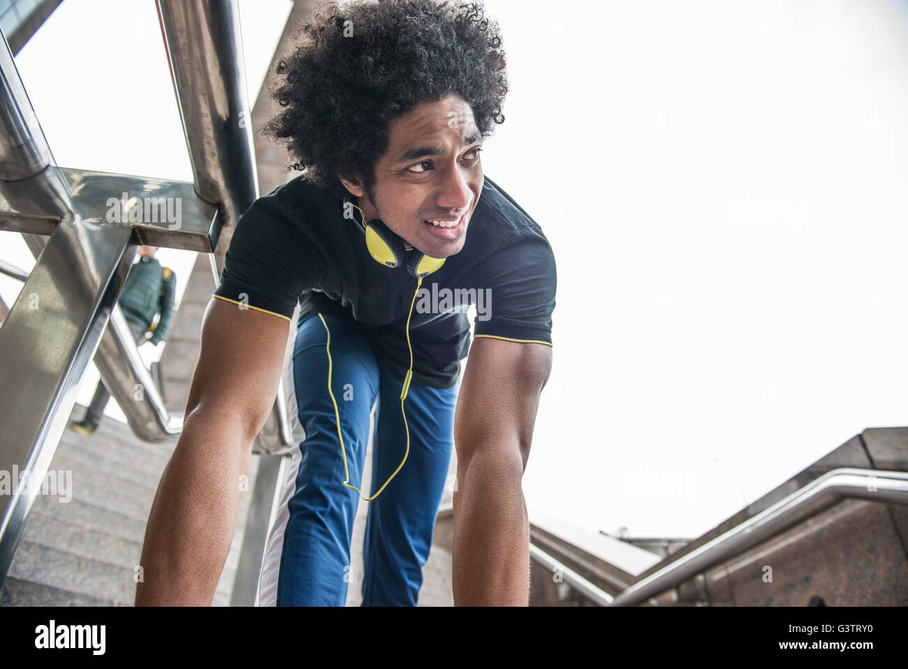 Young man limbering up jog hi-res stock photography and images - Alamy