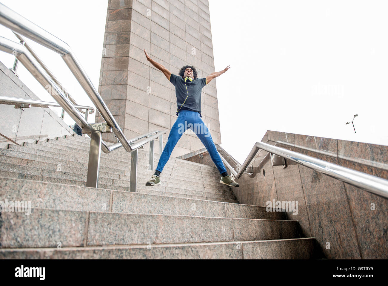 Young man limbering up jog hi-res stock photography and images - Alamy