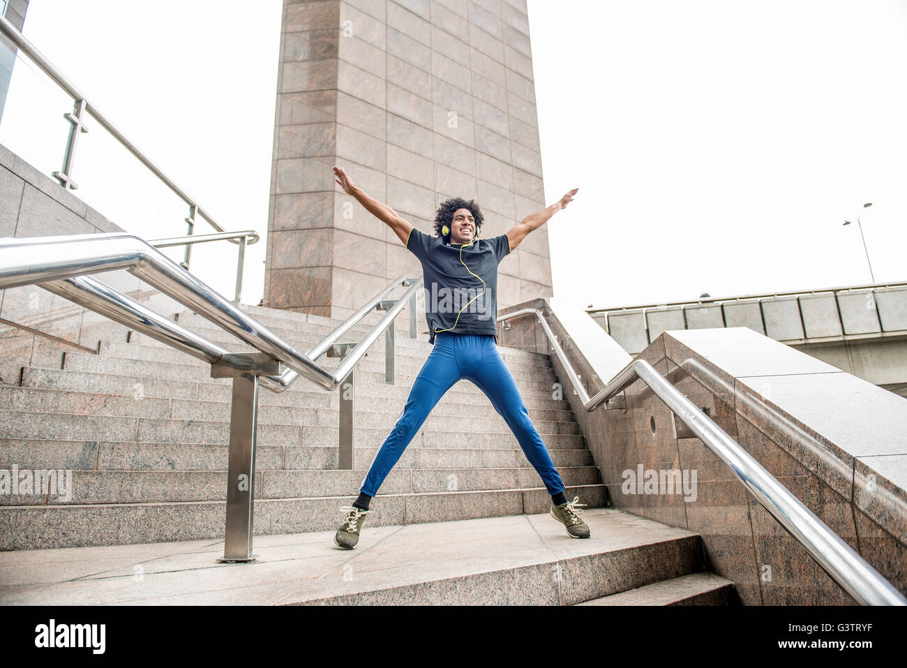 Young man limbering up jog hi-res stock photography and images - Alamy