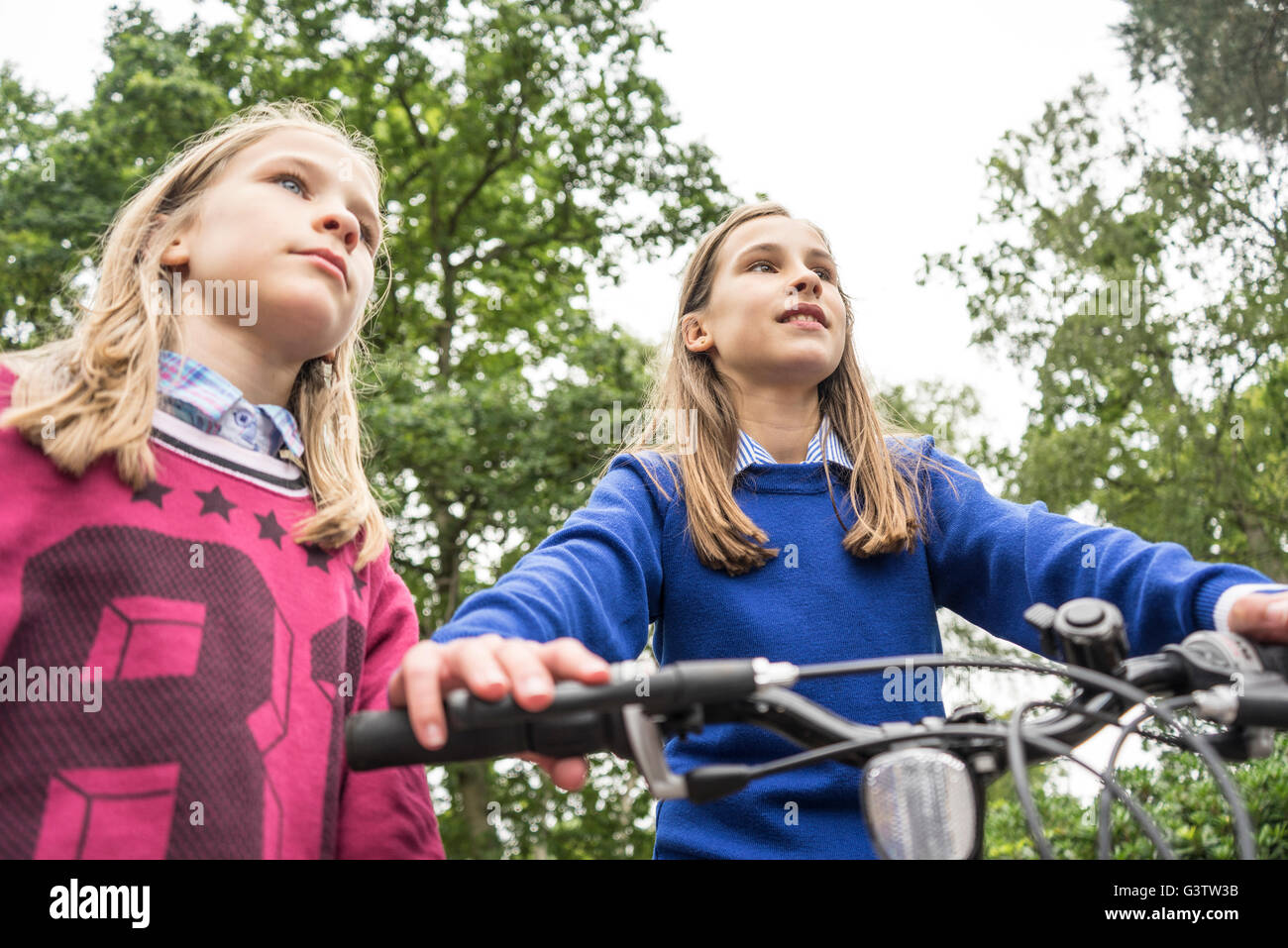 Children playing with bicycle hi-res stock photography and images - Alamy