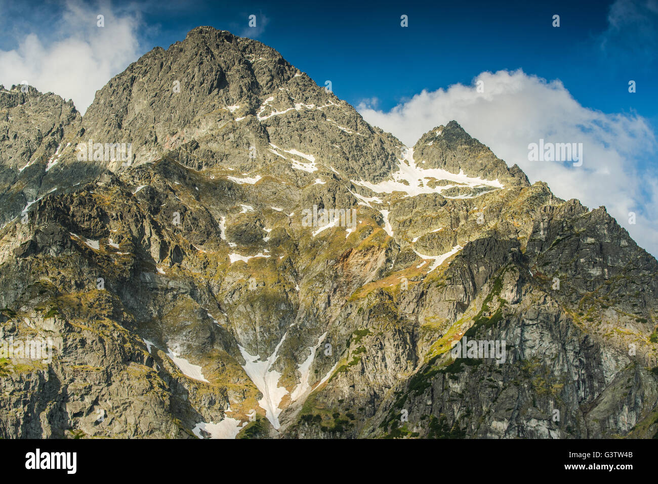 High rocky summit in Tatra mountains at early morning with blue sky Stock Photo - Alamy