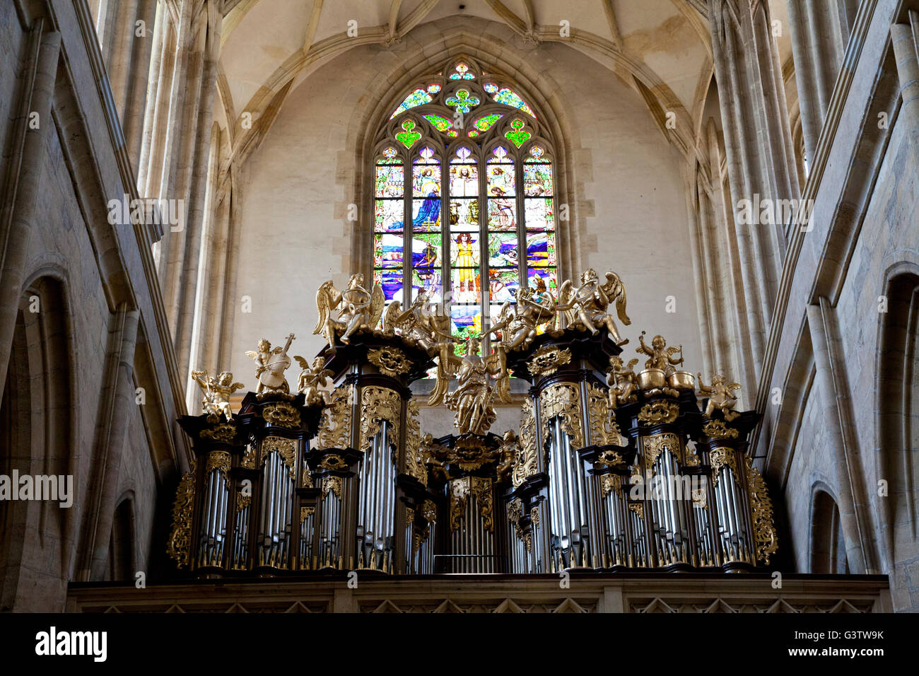 Ornate organ and stained glass window in the Church of St. Barbara in ...