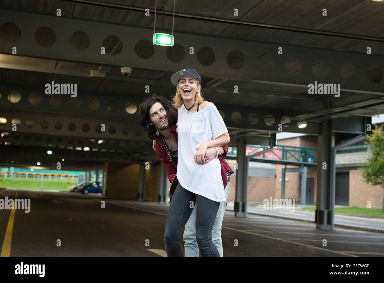A cool young couple cuddling Stock Photo - Alamy