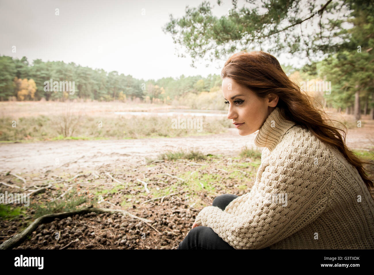 A young woman communing with nature on a forest walk in Autumn Stock ...
