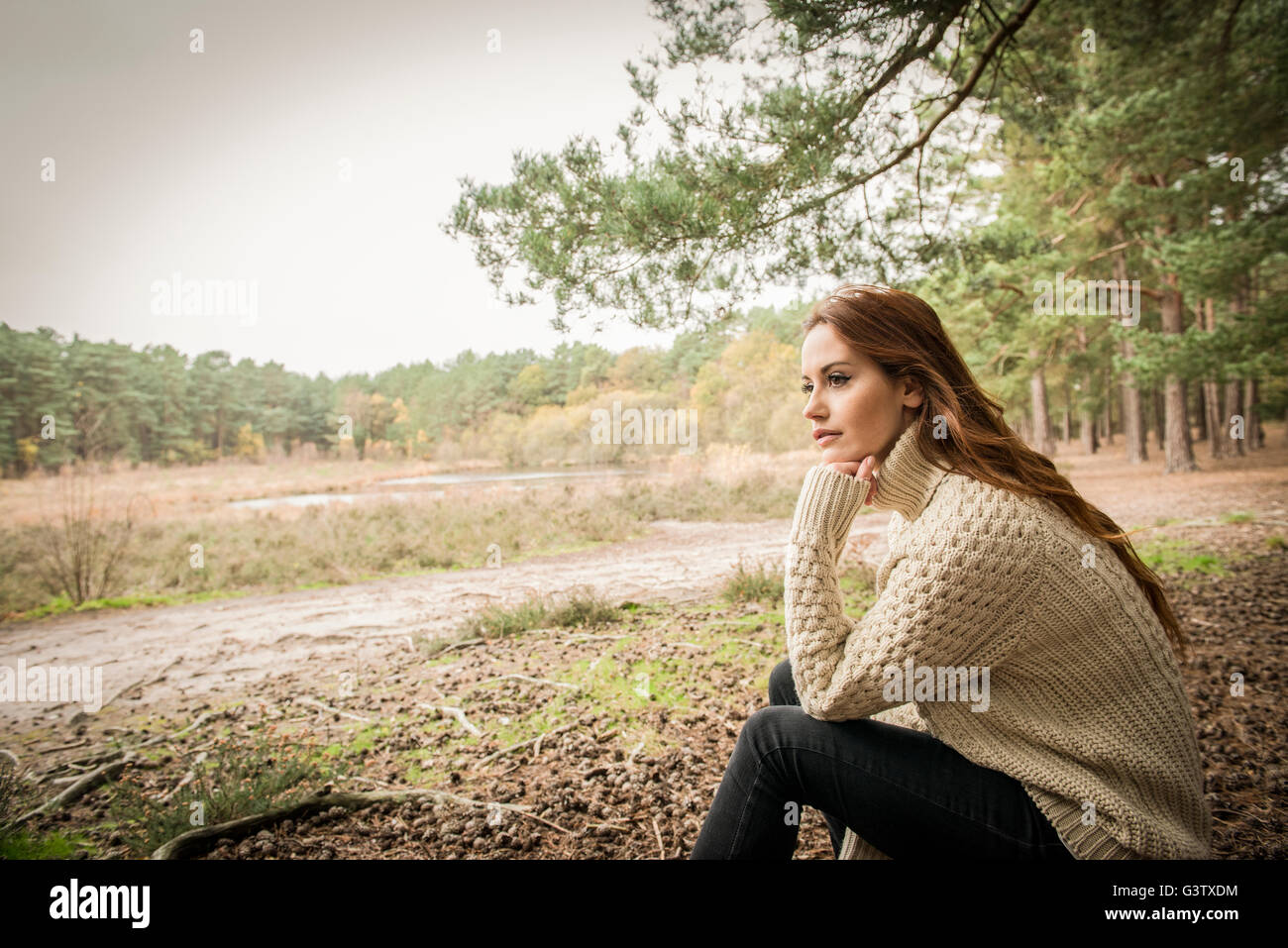 A young woman communing with nature on a forest walk in Autumn Stock ...