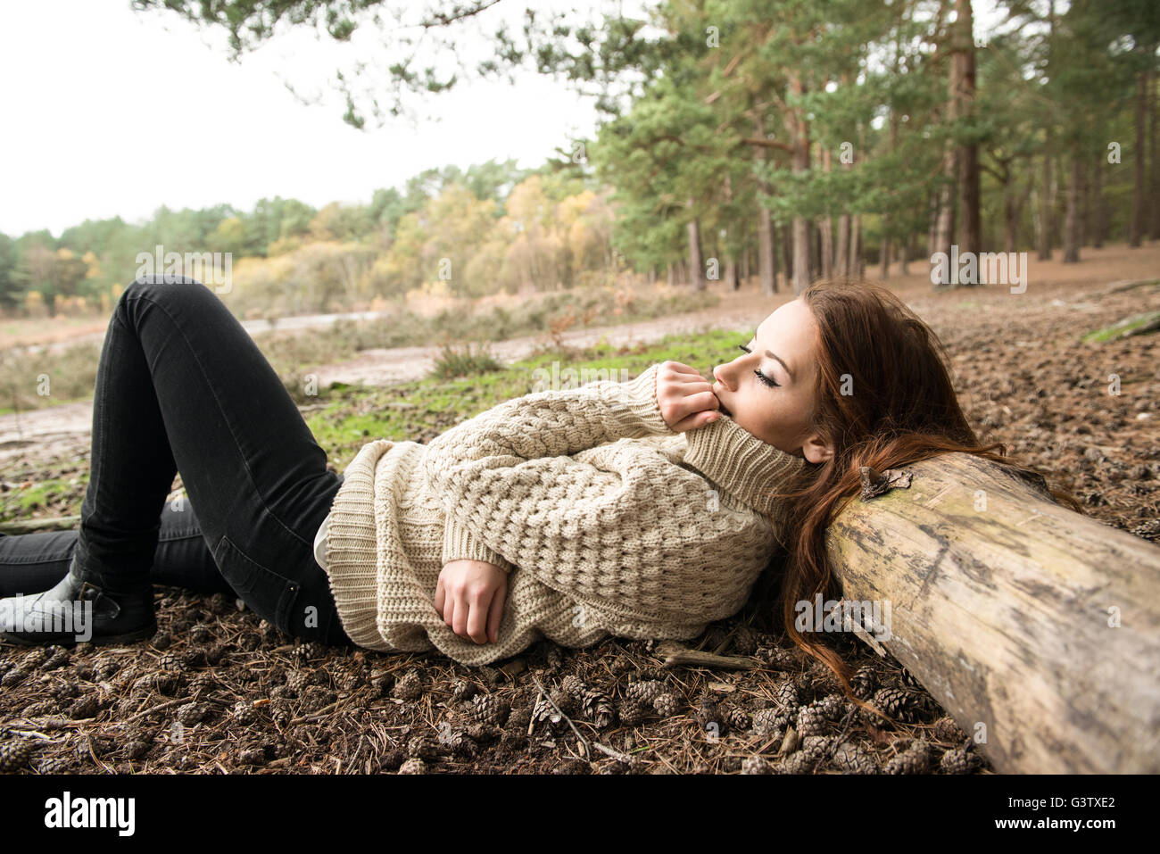 A young woman communing with nature on a forest walk in Autumn Stock ...