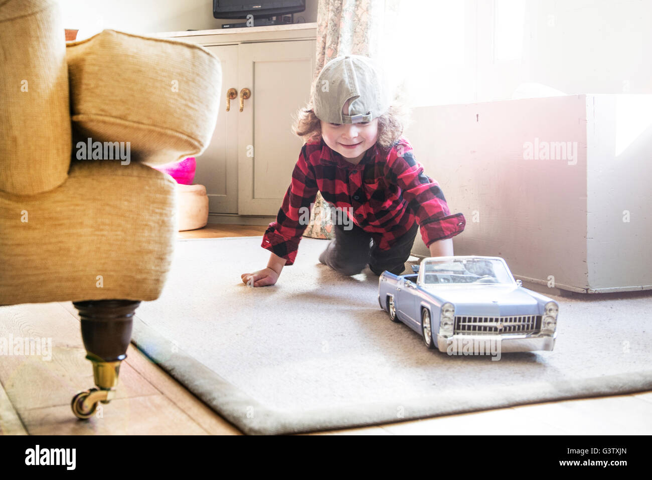 Playing childhood sitting toy car innocence hi-res stock photography ...