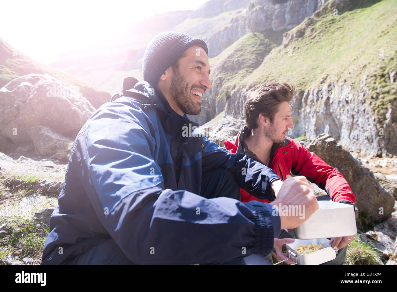 Two men hiking eating hi-res stock photography and images - Alamy