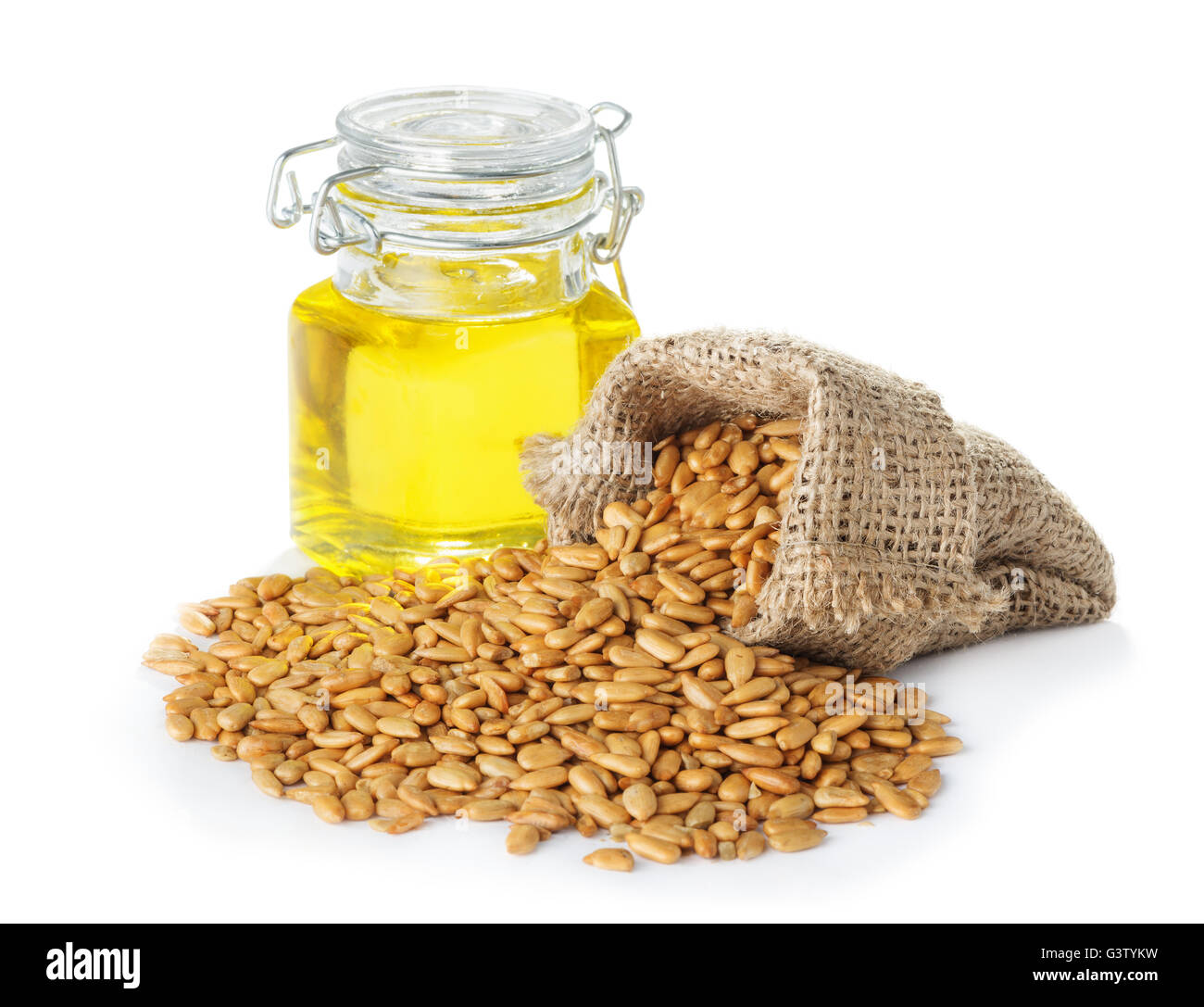 Sunflower oil and sunflower seeds close up isolated on white background ...