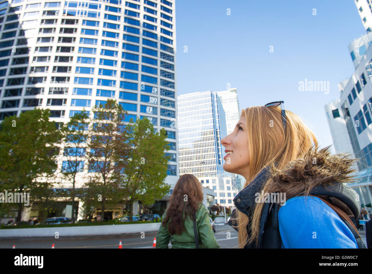 Beautiful girl looking at the buildings in Vancouver Stock Photo - Alamy
